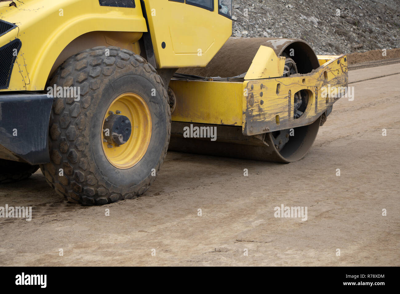 Vibratory soil compactor working on highway construction site Stock ...