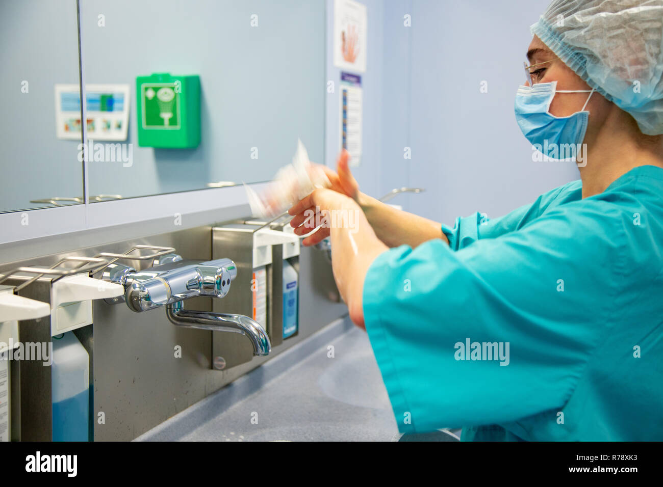 Surgeon washing hands before surgery hi-res stock photography and ...