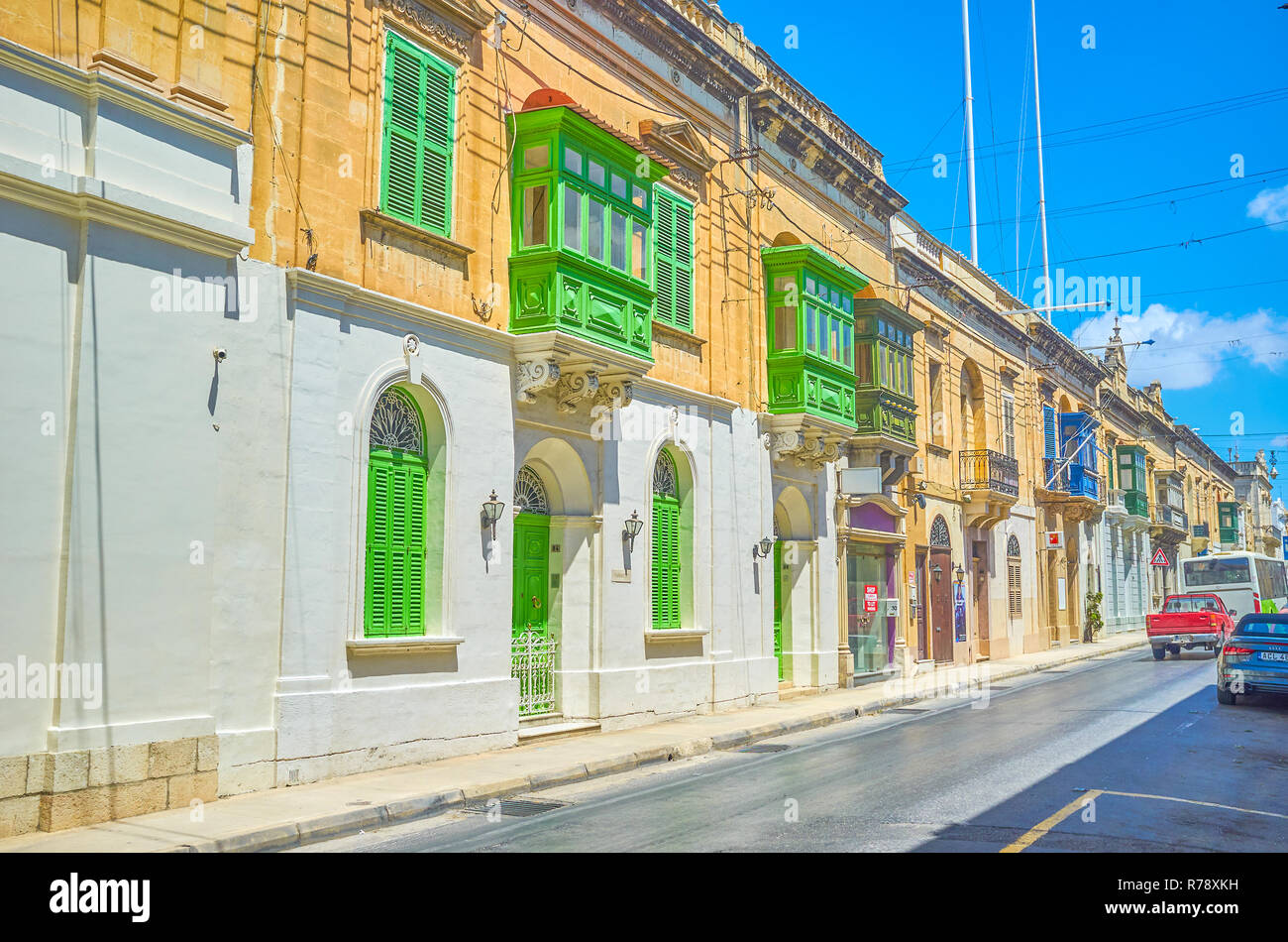 MOSTA, MALTA - JUNE 14, 2018: The typical Maltese street with small old ...
