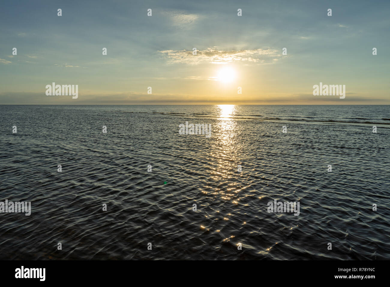 colorful sunset or sunrise in the sea with bright colors and dramatic ...