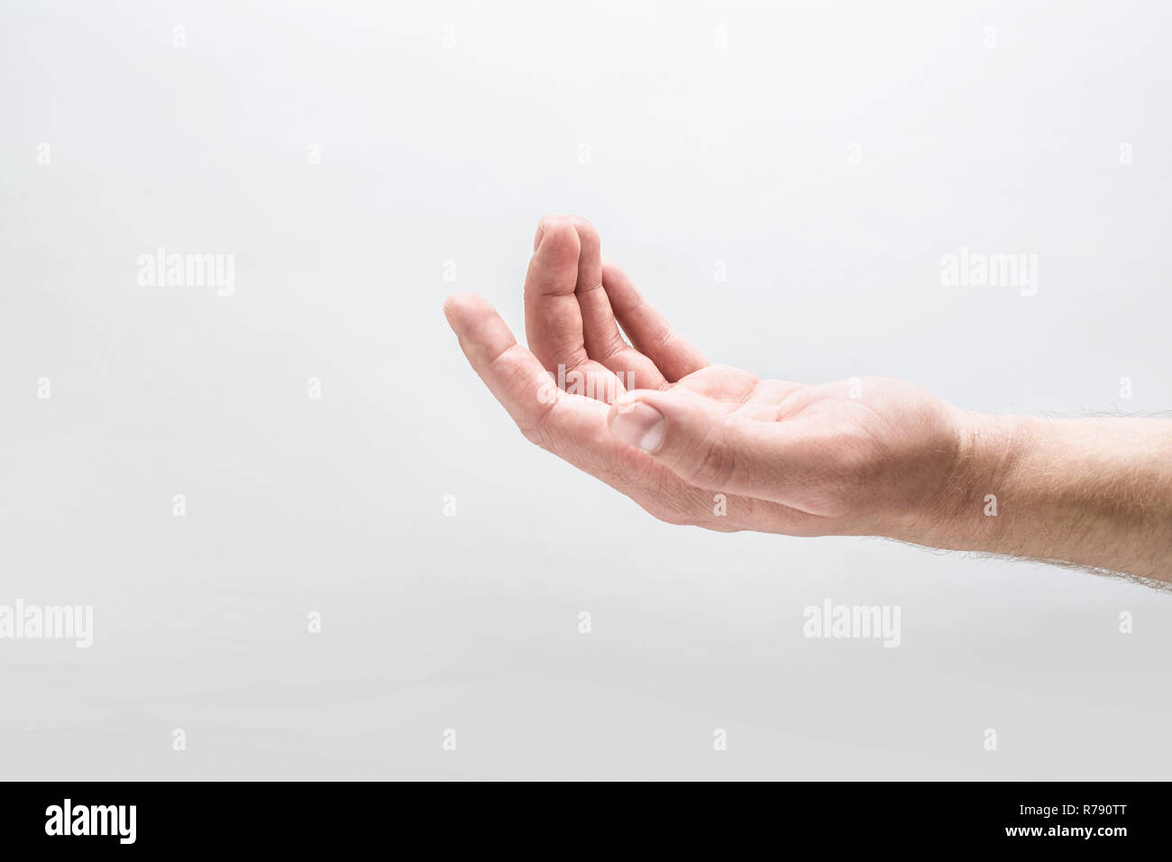 Close up of male hand. It is relaxed. Isolated on white background ...