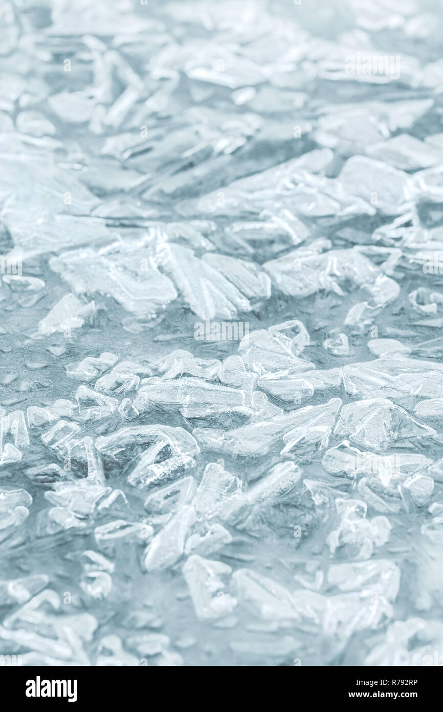 Frozen river surface. Melting rippled ice block with cracks and various ...