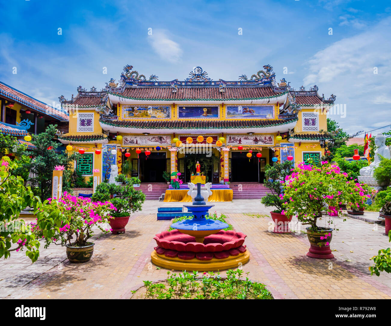 Amazing view of Chua Phap Bao Pagoda through a courtyard garden with ...