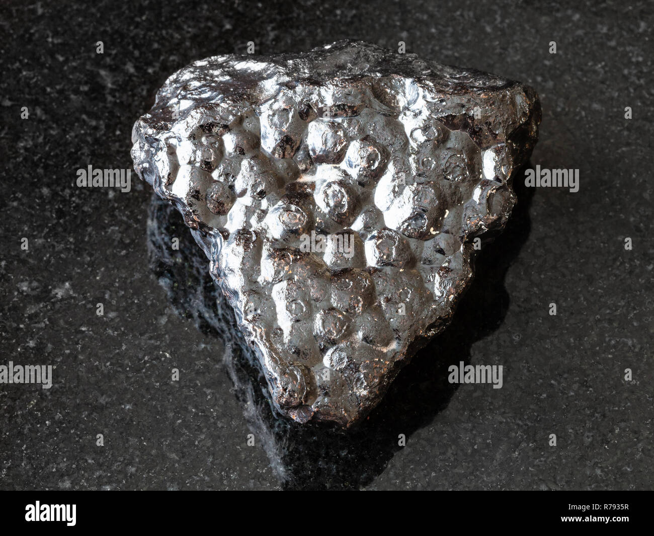 rough Hematite (Kidney Ore) stone on black Stock Photo - Alamy