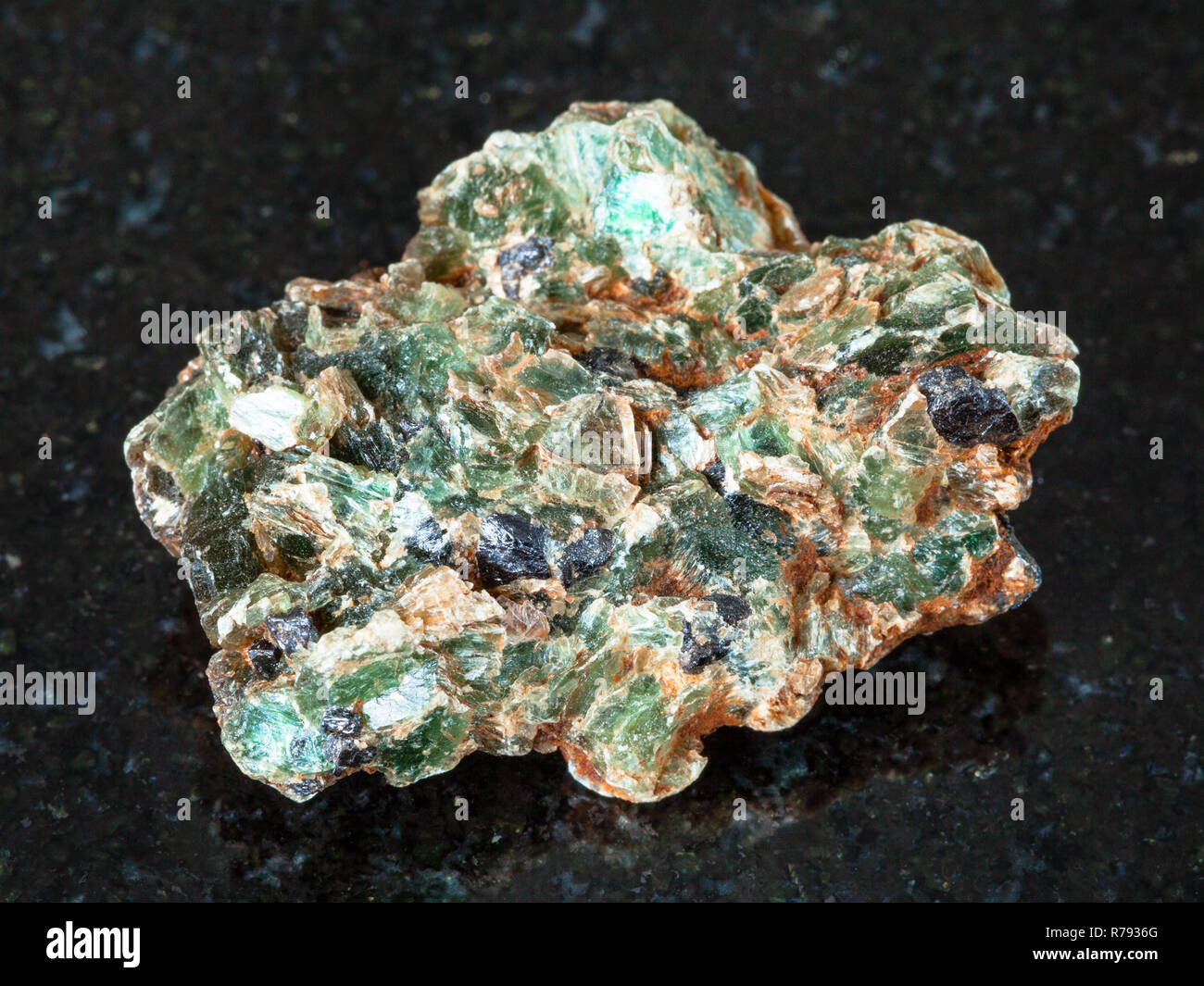 green beryl crystals in rough rock on black Stock Photo - Alamy