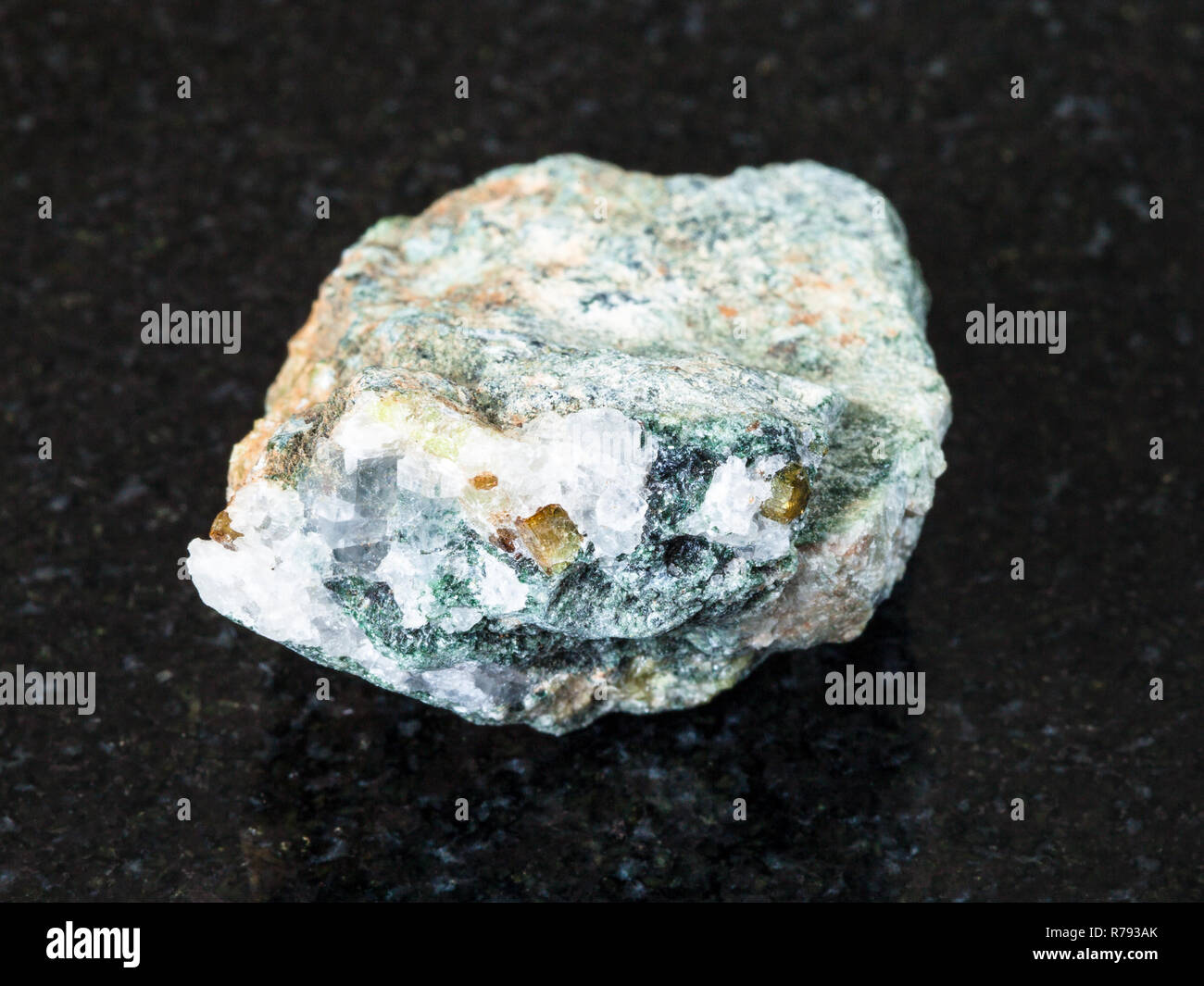 Chrysoberyl crystals in rough beryl rock on black Stock Photo - Alamy