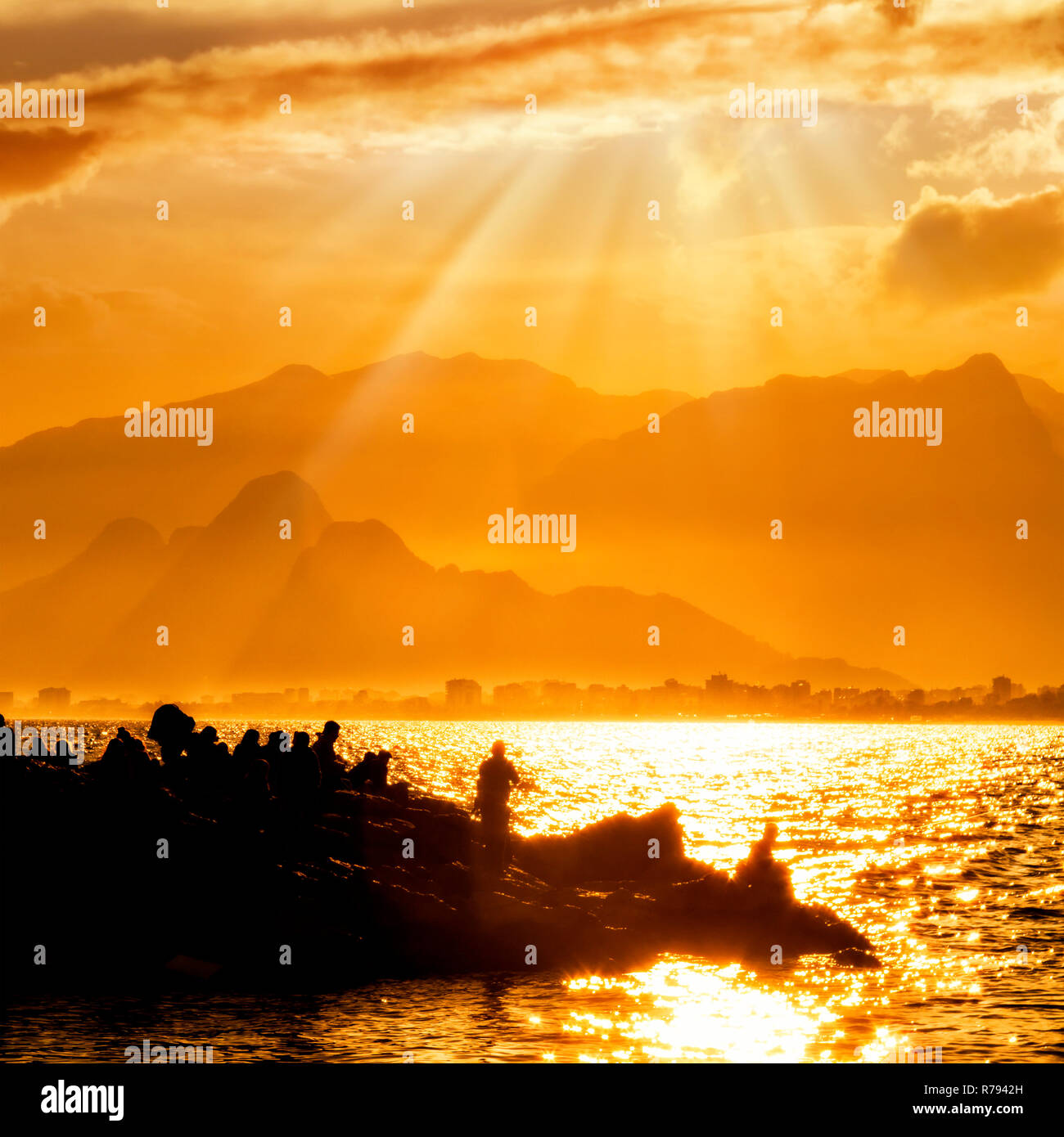 people at beach during sunset Stock Photo - Alamy
