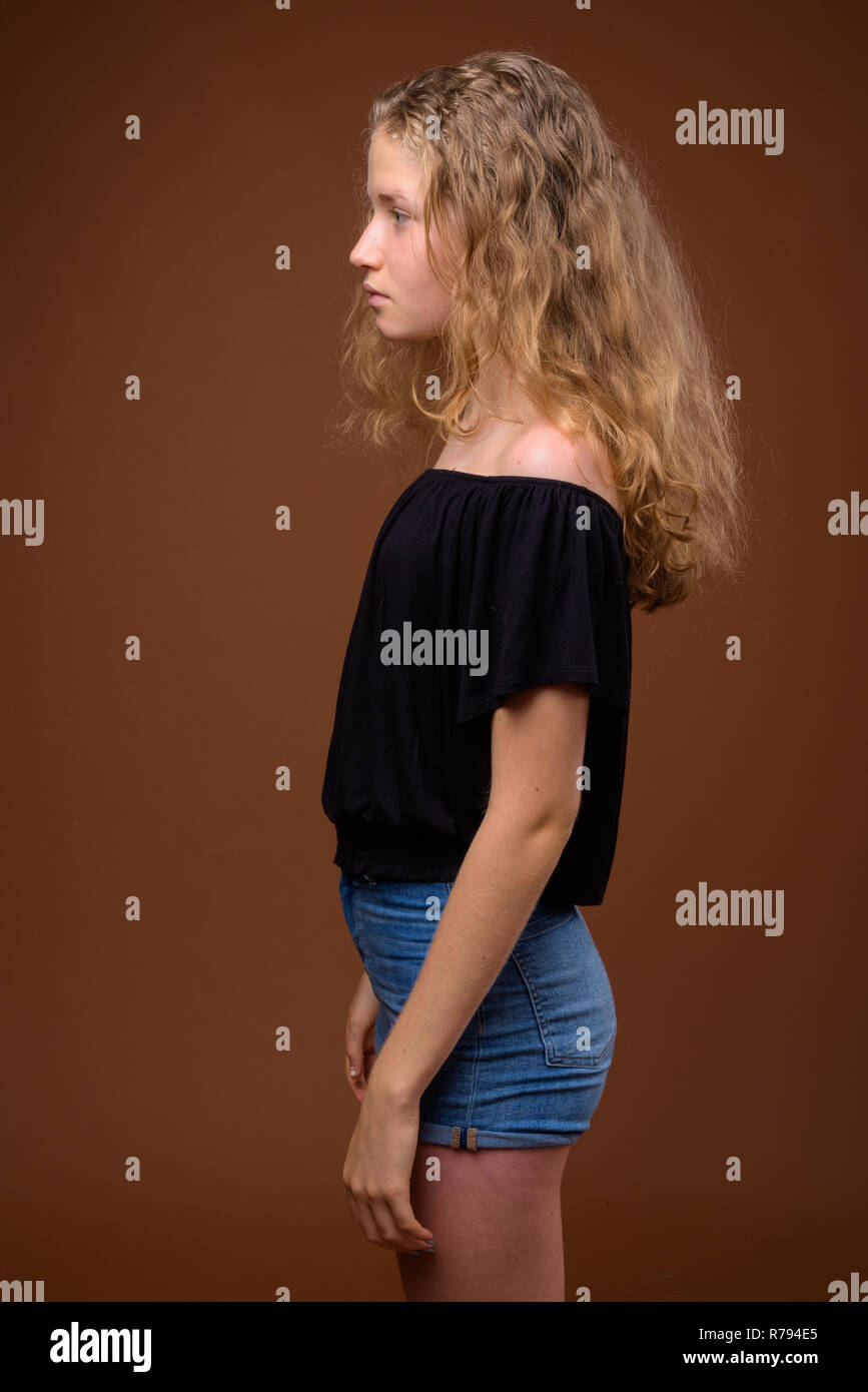 Profile View Portrait Of Young Beautiful Blonde Teenage Girl Stock