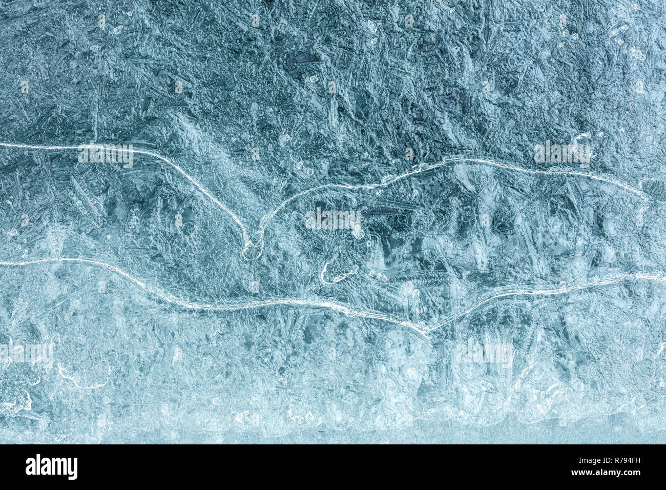 Crystal ice block surface with cracks macro view. Natural winter ...