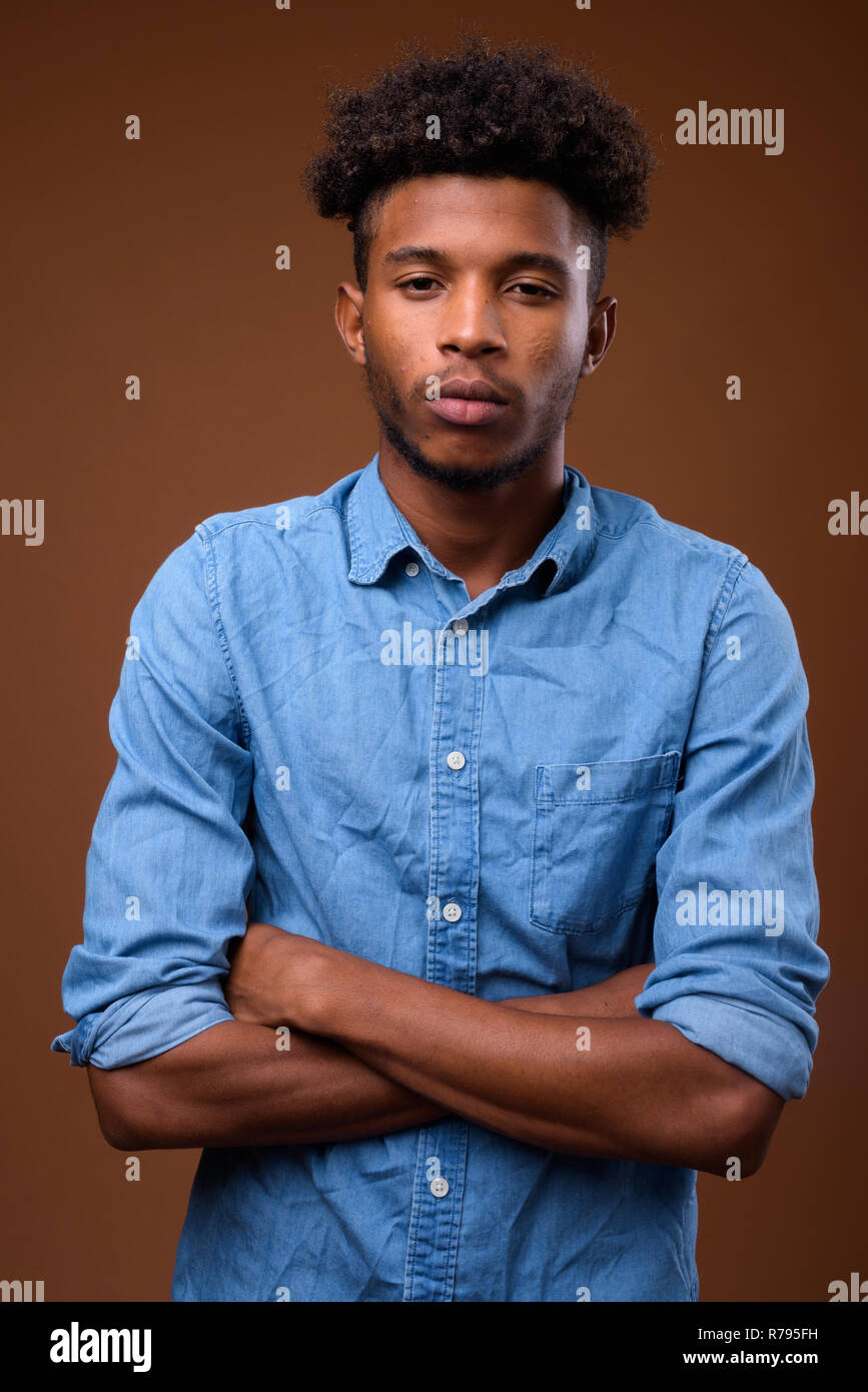 Portrait handsome african guy arms hi-res stock photography and images ...