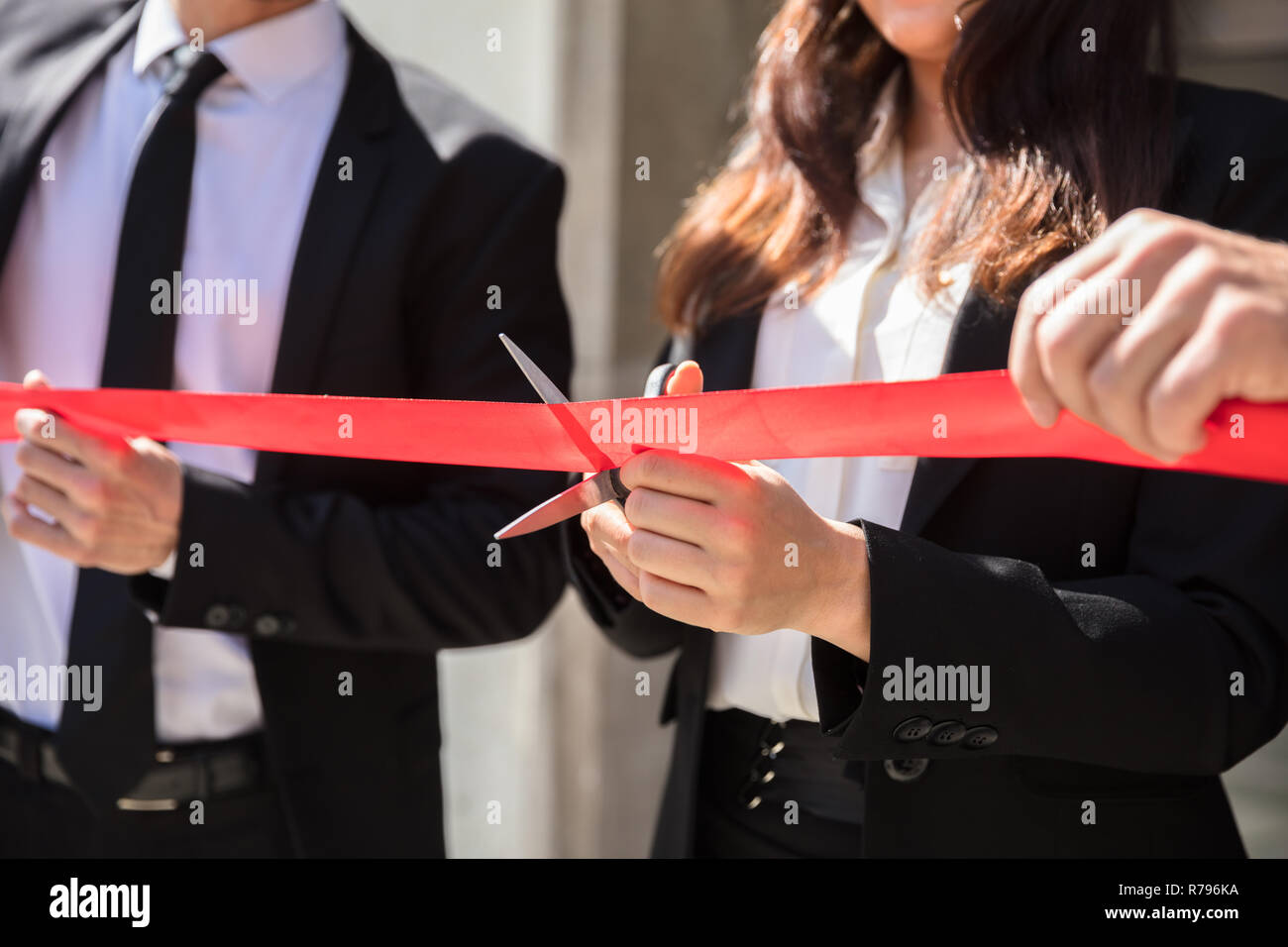 Cutting red tape hi-res stock photography and images - Alamy