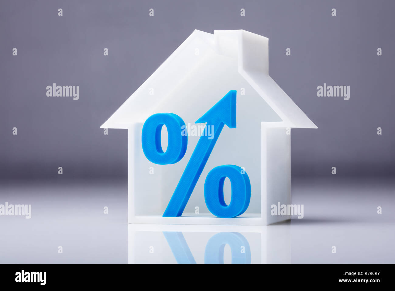 Percentage Symbol Inside House Model Stock Photo - Alamy