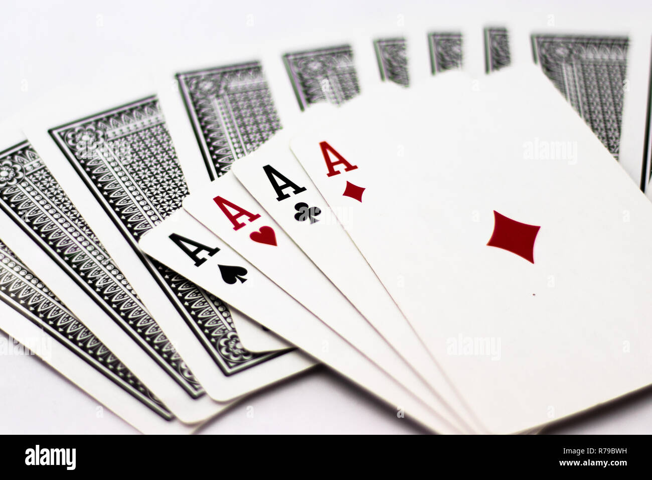 Playing Cards - Ace from each Suit fanned out across back of cards ...