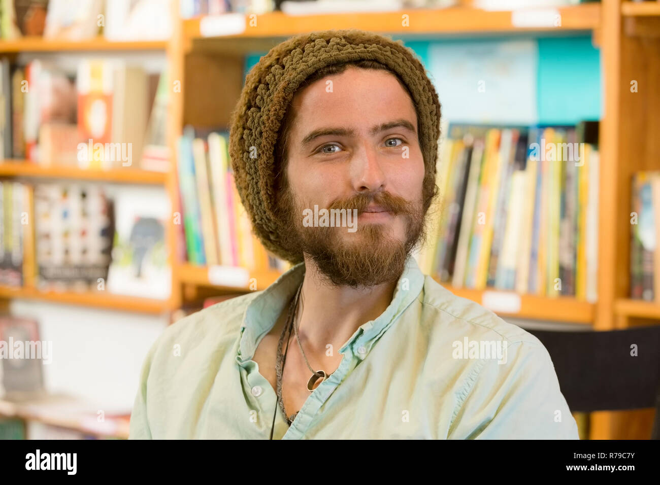 Handsome Man in Book Store or Library Stock Photo - Alamy
