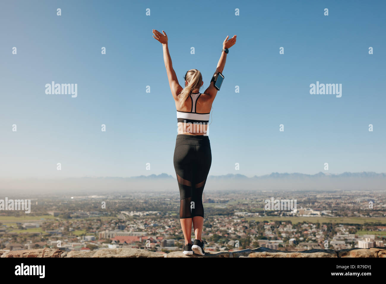 Woman arms raised rear view sky hi-res stock photography and images - Alamy