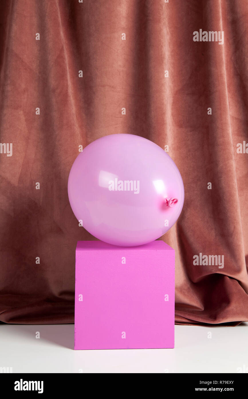 colourful velvet pink balloon cube podium Stock Photo - Alamy