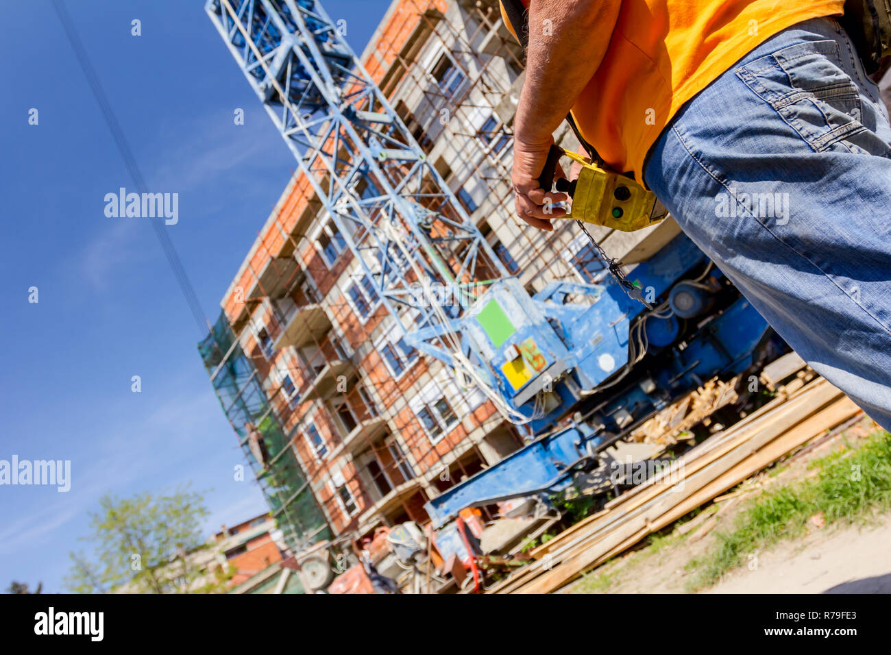 Operator, worker is holding industrial remote, wireless, console to ...