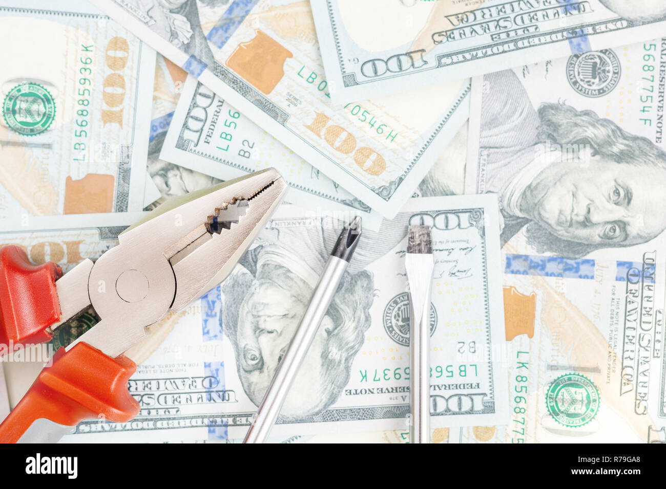 Money screwdriver hi-res stock photography and images - Alamy