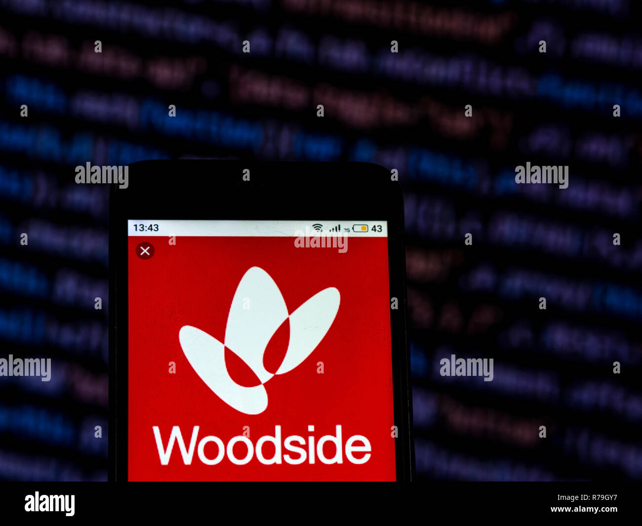 Woodside Petroleum Company logo seen displayed on smart phone Stock ...