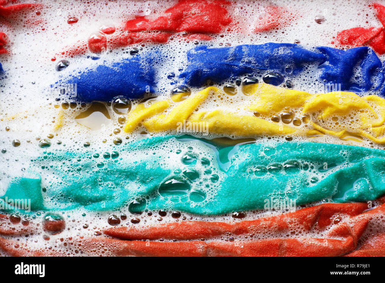 Soak a cloth before washing, Color clothes Stock Photo - Alamy