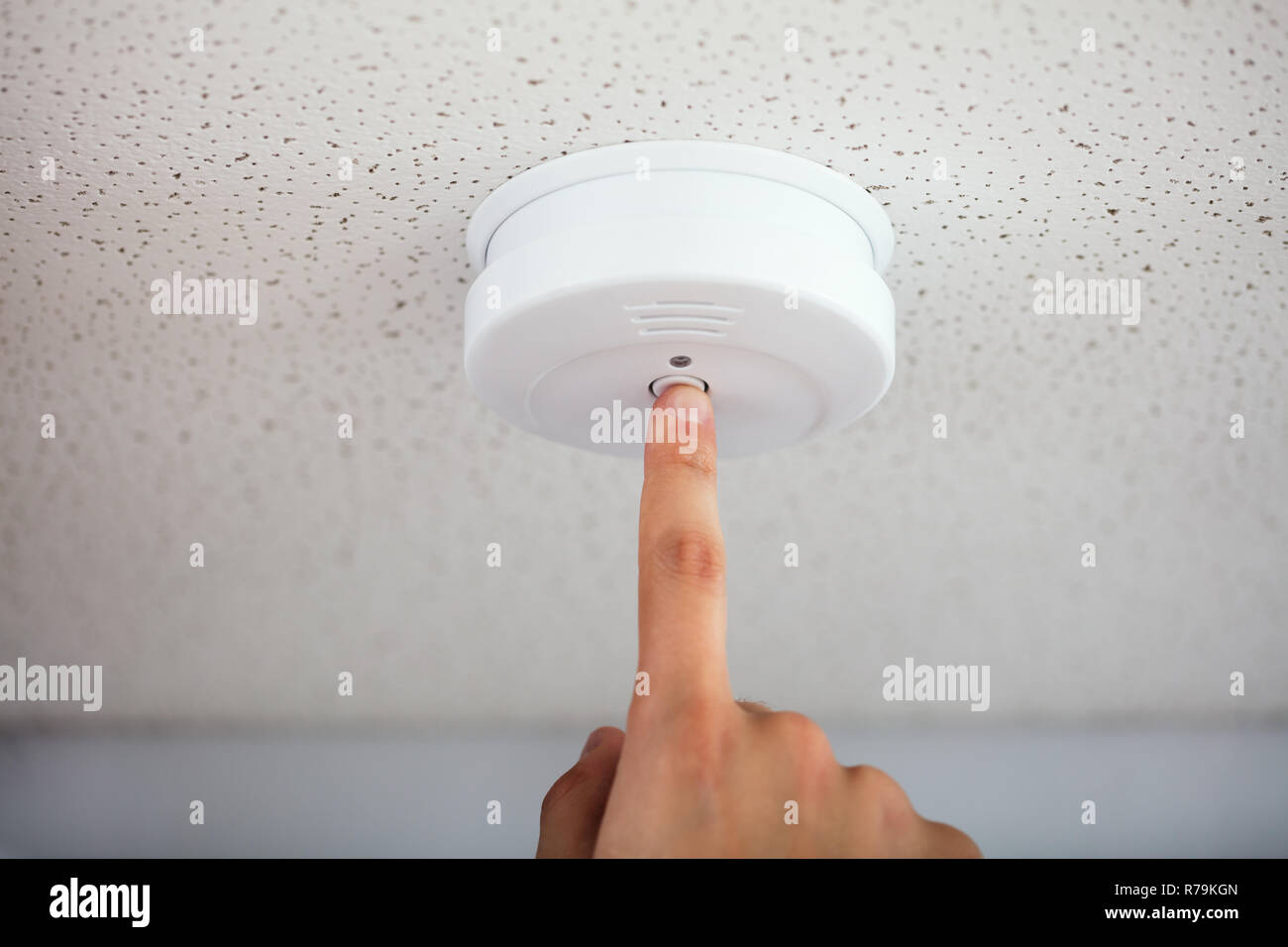 Person Testing Smoke Detector Stock Photo - Alamy