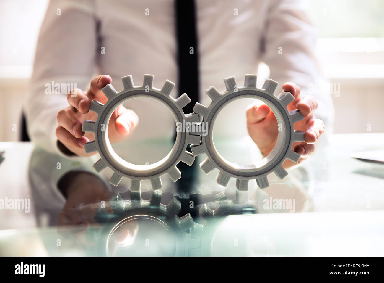 Business people connecting gears hi-res stock photography and images ...