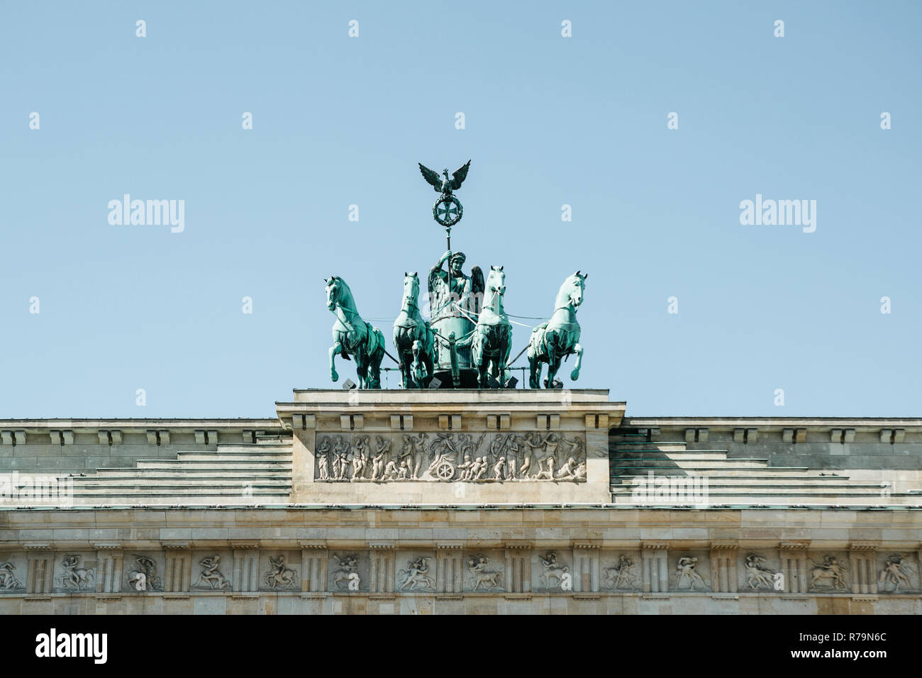 Closeup of the Brandenburg Gate against the blue sky. This is one of ...