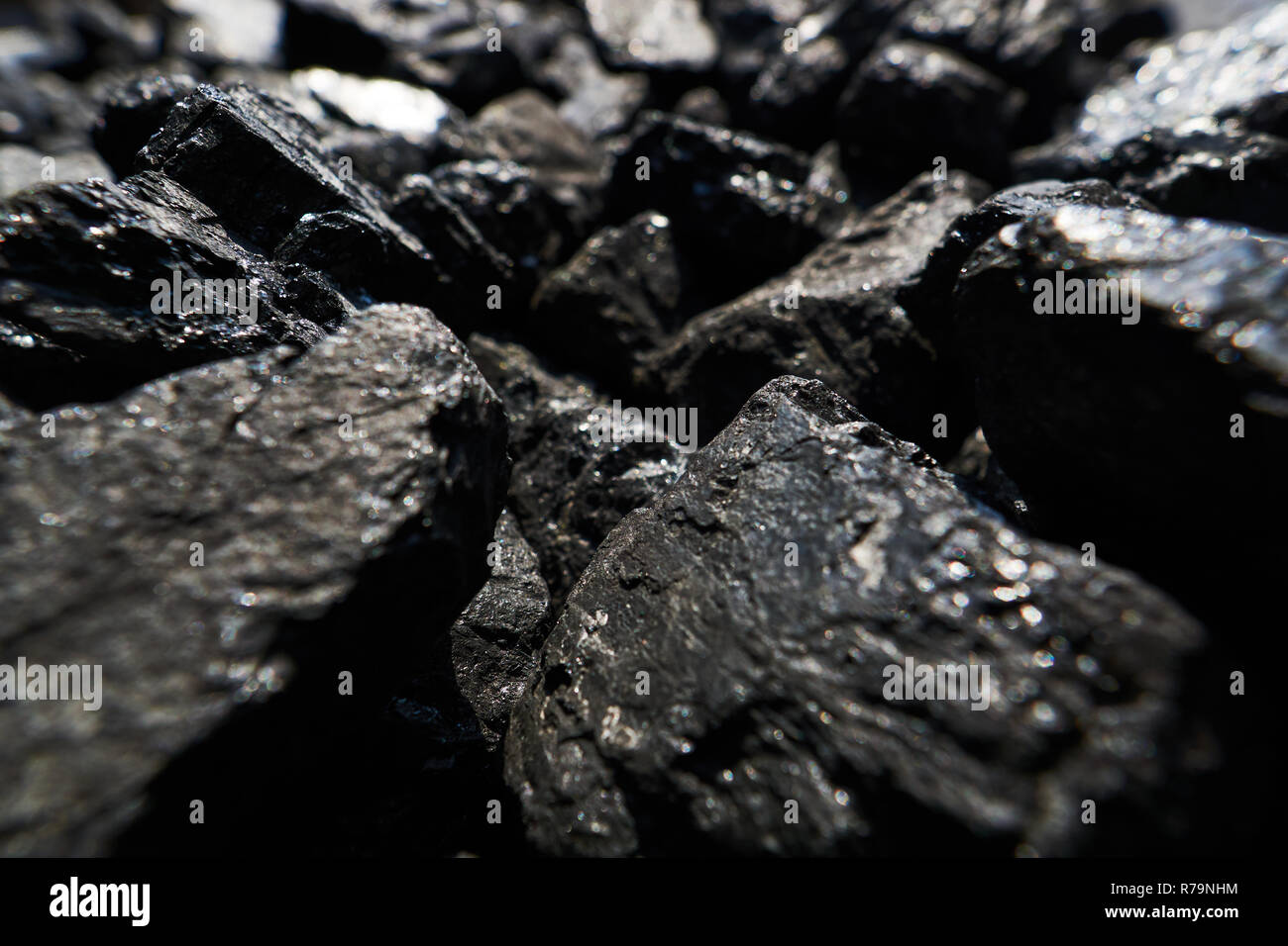 Raised black coal shines in the sunlight of midday Stock Photo - Alamy