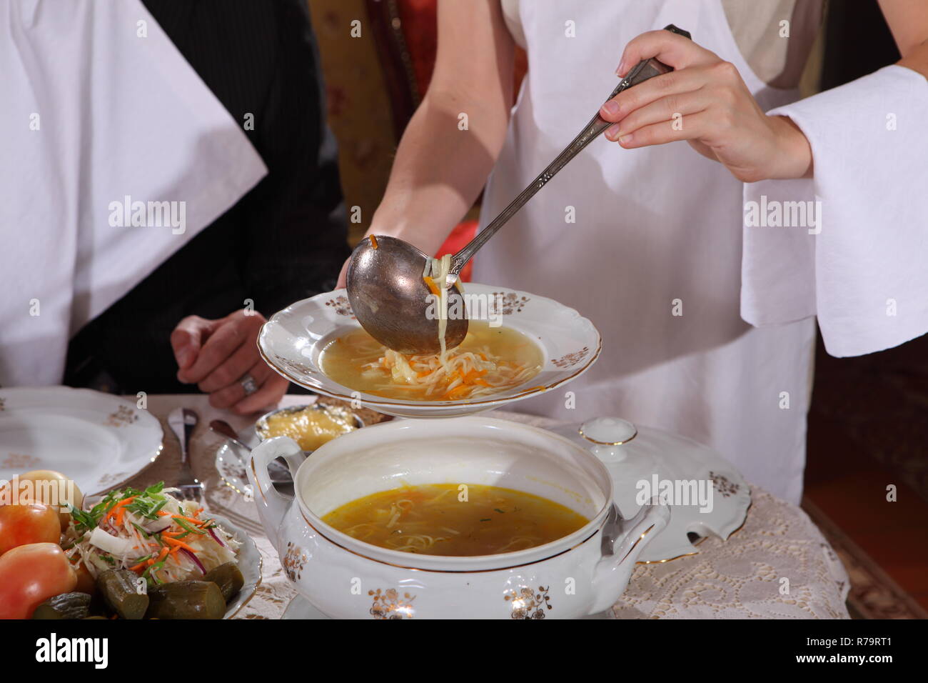 Pouring soup plate restaurant hi-res stock photography and images - Alamy