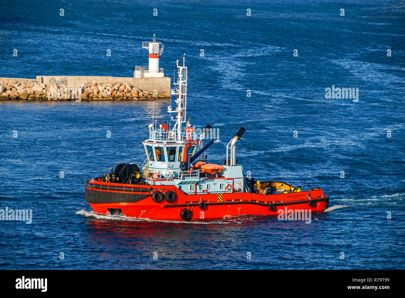 Tug boat megalochari VI at entrance to port of Piraeus Athens Greece ...