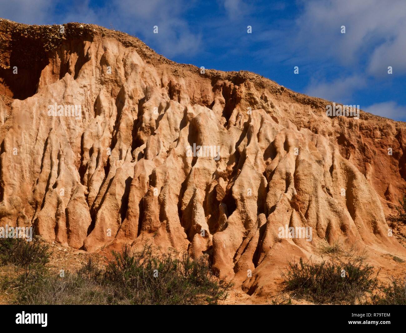 High red cliffs at the beach Praia da Falesia in Albufeira at the ...