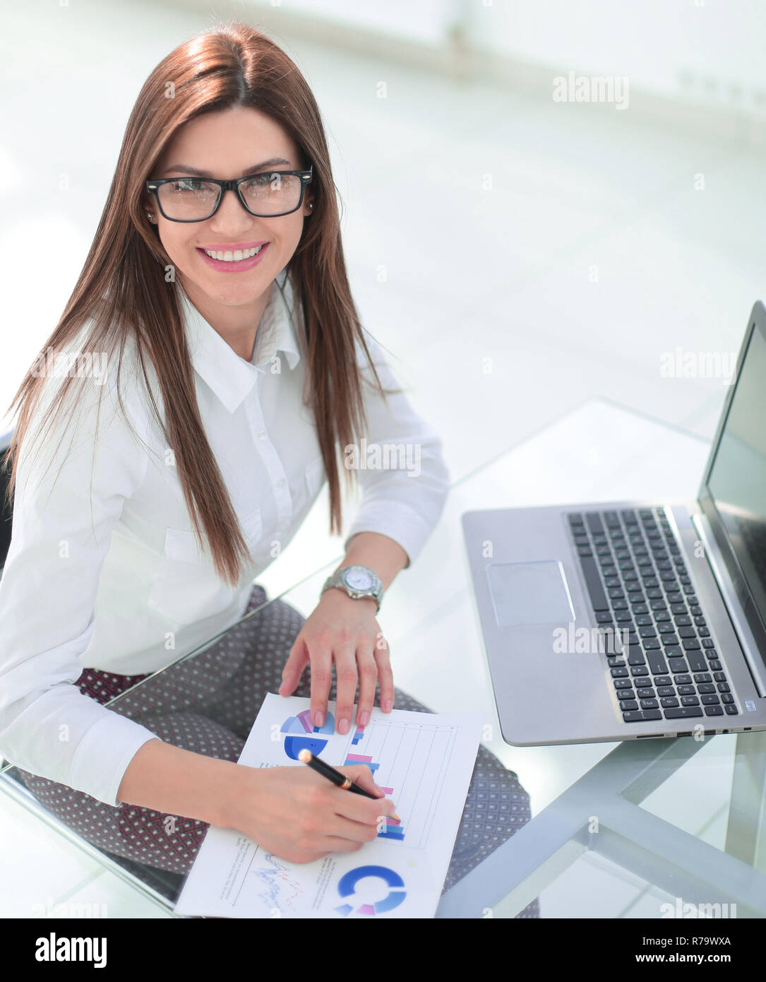 business woman working by checking financial report Stock Photo - Alamy