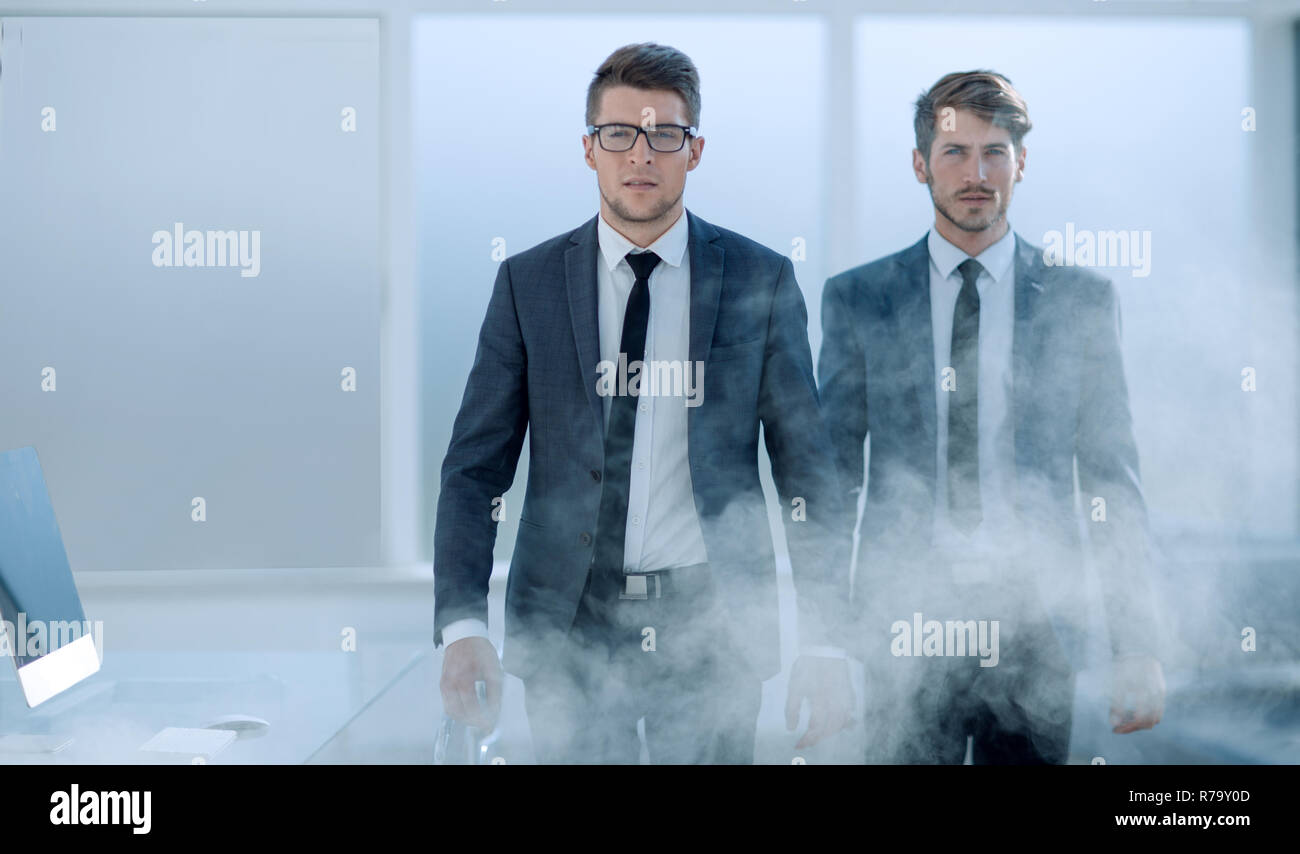 young business people in a smoky office Stock Photo - Alamy