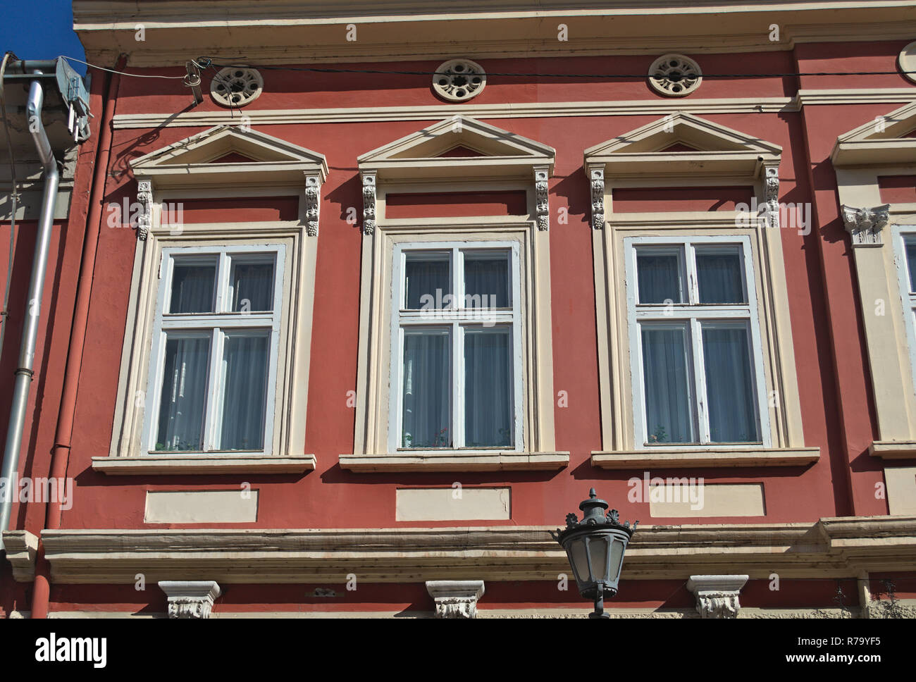 Windows on an old restored 19th century building Stock Photo - Alamy