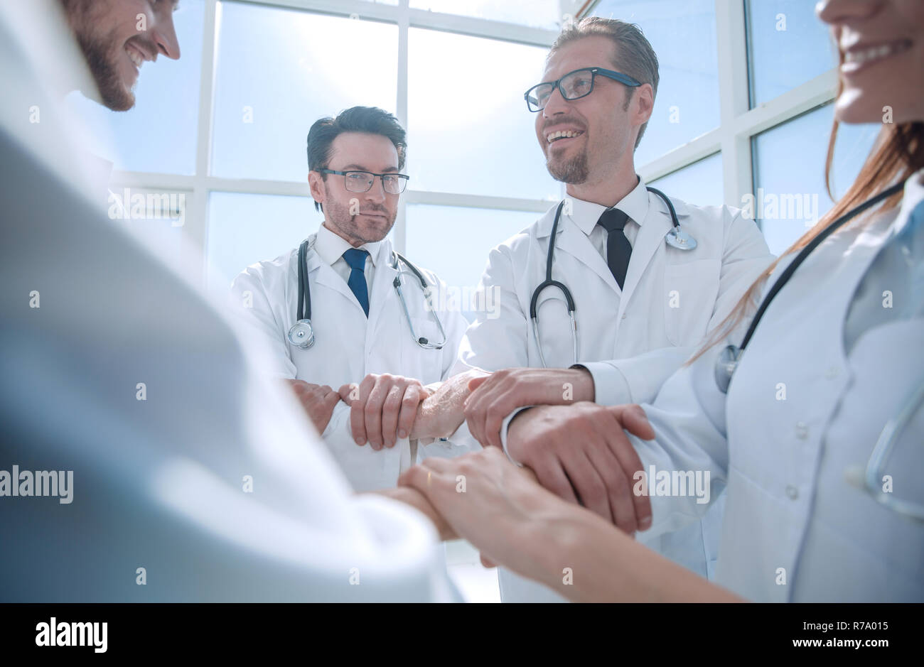 close up.a group of doctors standing in a circle Stock Photo - Alamy