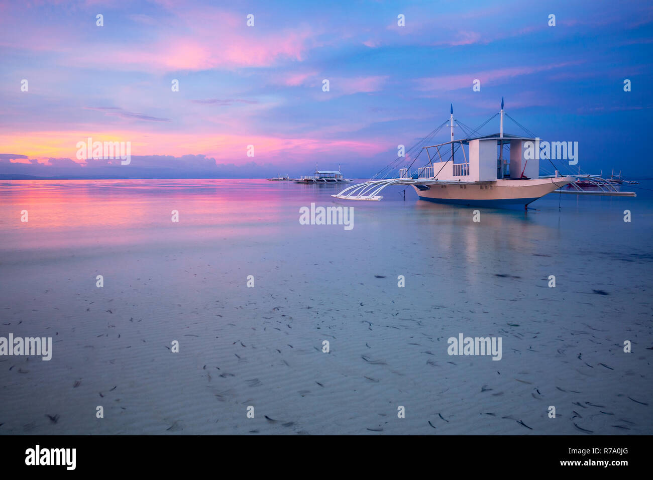 Stunning view of the sunset on the Philippine beach. Doljo beach ...