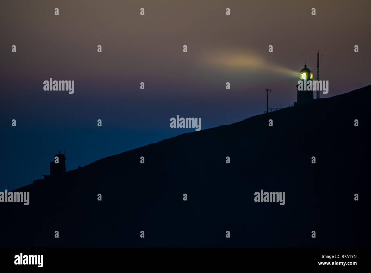 Matxitxako lighthouse ray of light at dawn, Basque Country Stock Photo ...