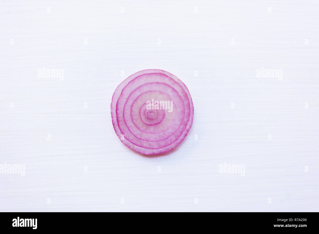 Slices of red onion on white background Stock Photo - Alamy