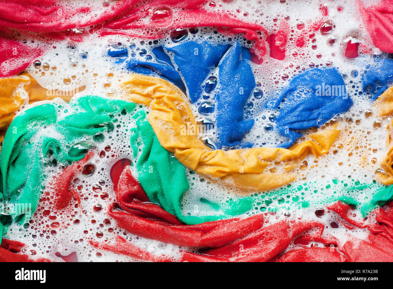 Soak a cloth before washing, Color clothes Stock Photo - Alamy