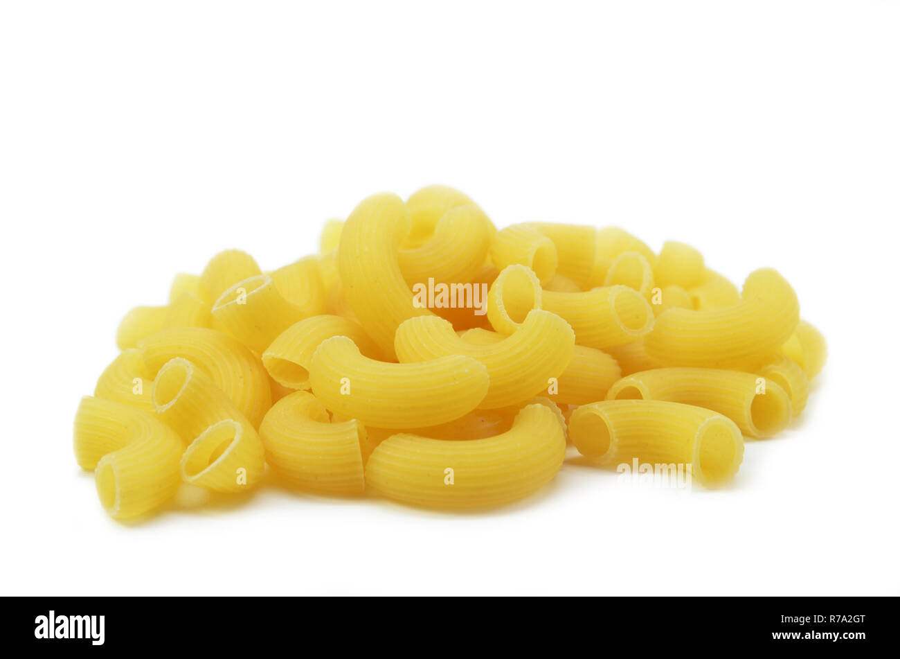 Uncooked macaroni isolated Stock Photo - Alamy