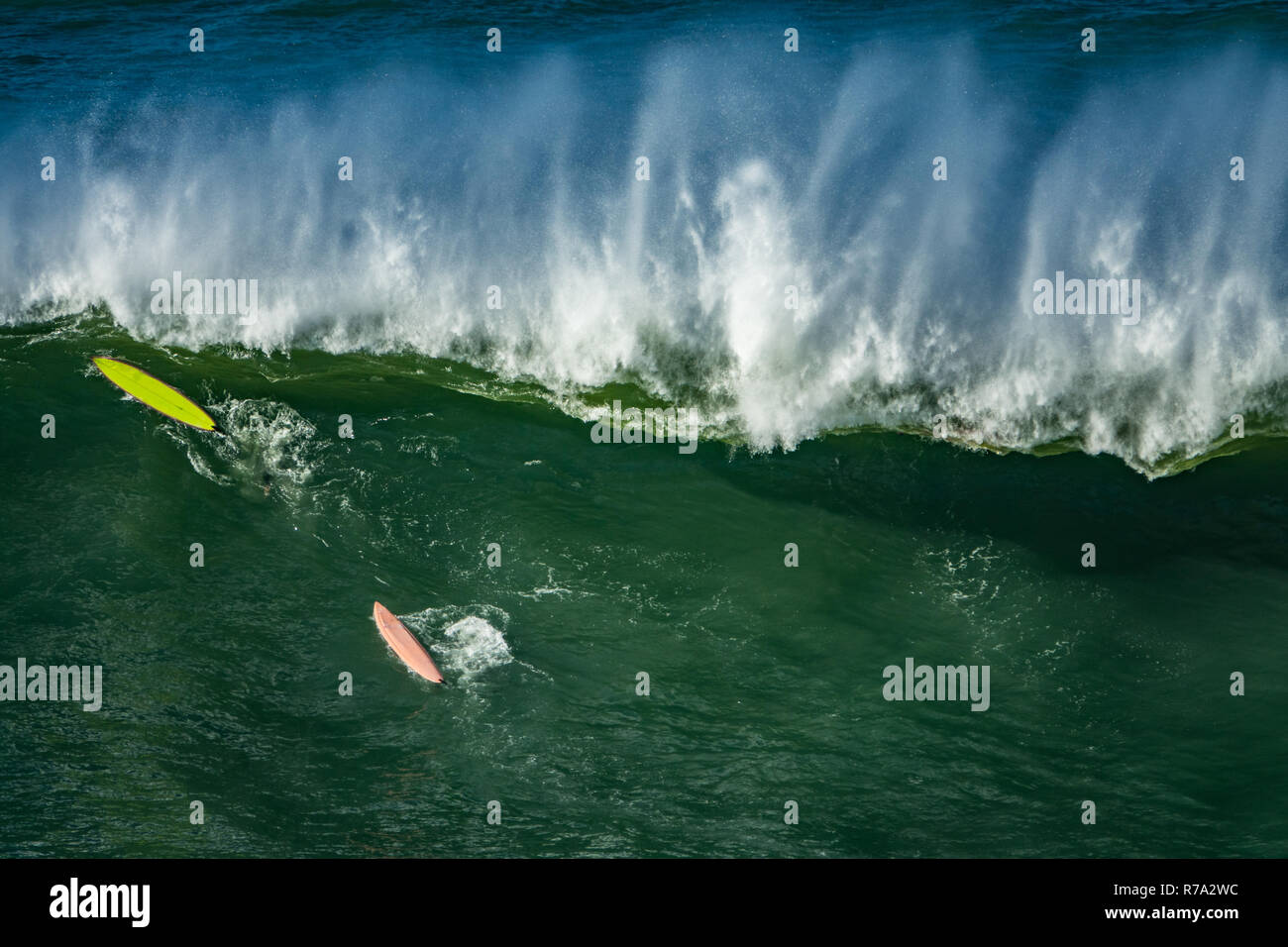 Surfers duck diving in a wave, Basque Country Stock Photo - Alamy