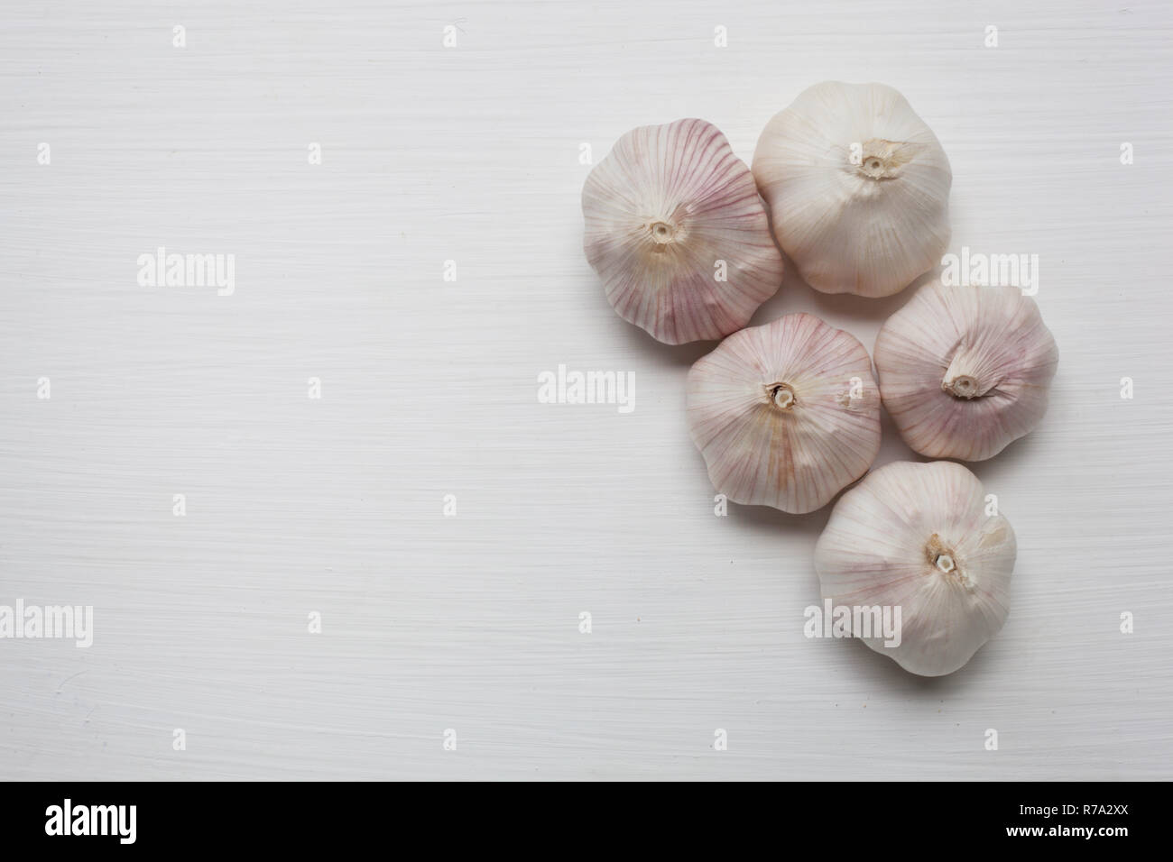 Garlic on white background Stock Photo - Alamy