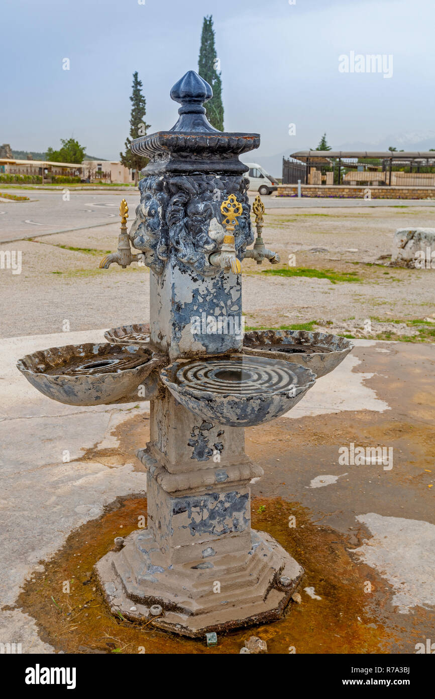 Ancient fountain brass tap hi-res stock photography and images - Alamy