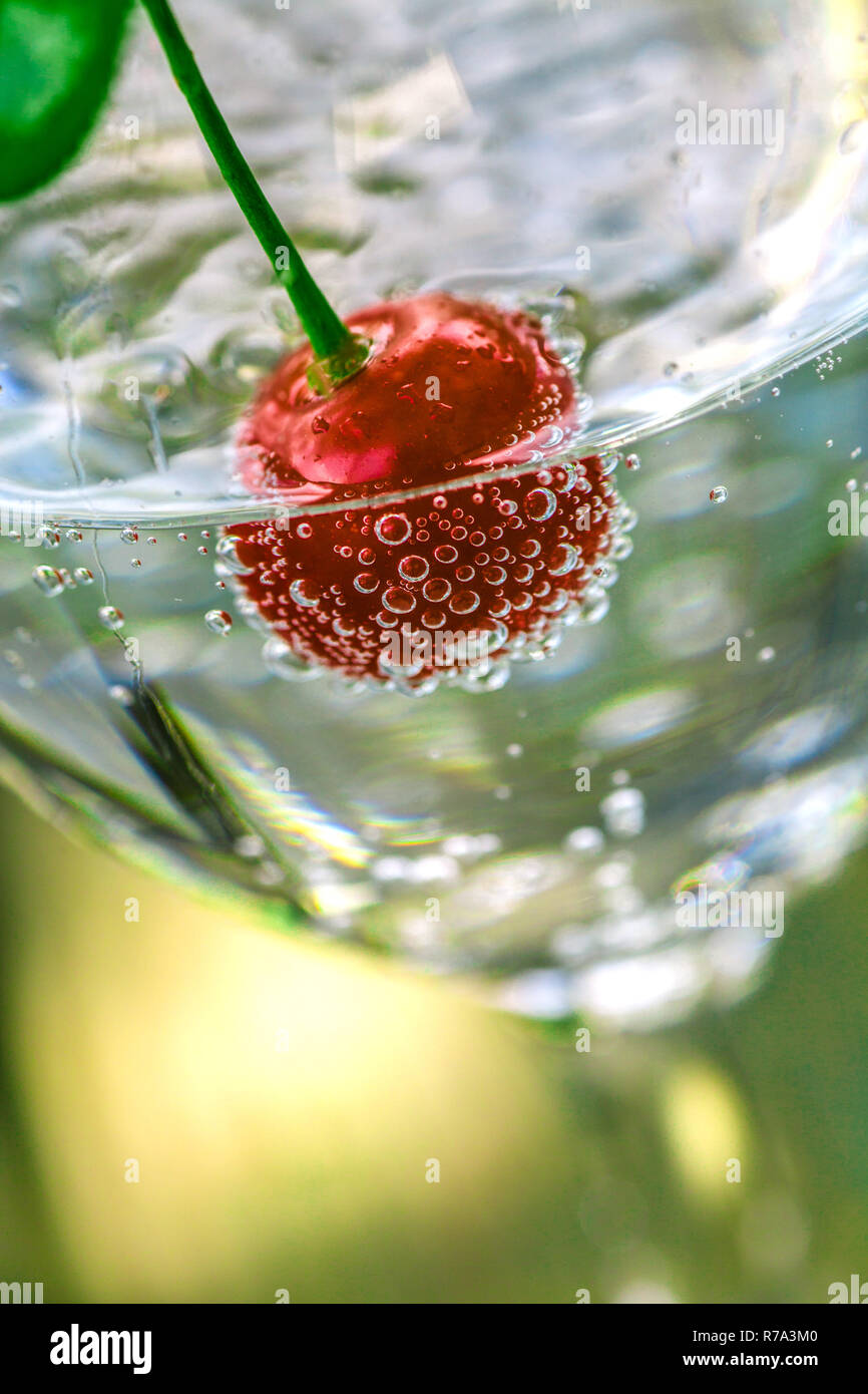 Fizzy drink with cherry Stock Photo - Alamy