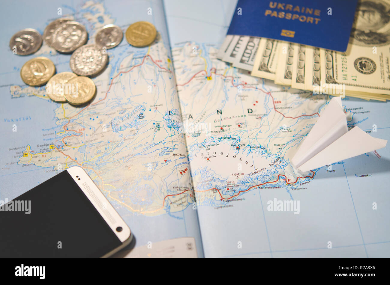 The plane, smartphone, biometric passport, dollars, coins and credit ...