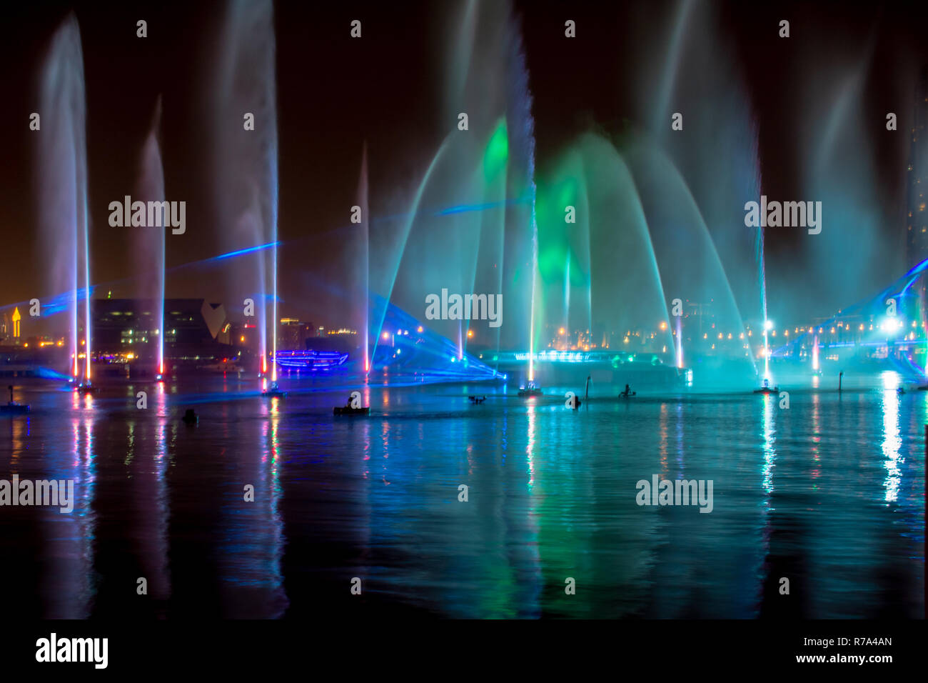 An impressive water, fire, and light show at night in the pond in Dubai ...