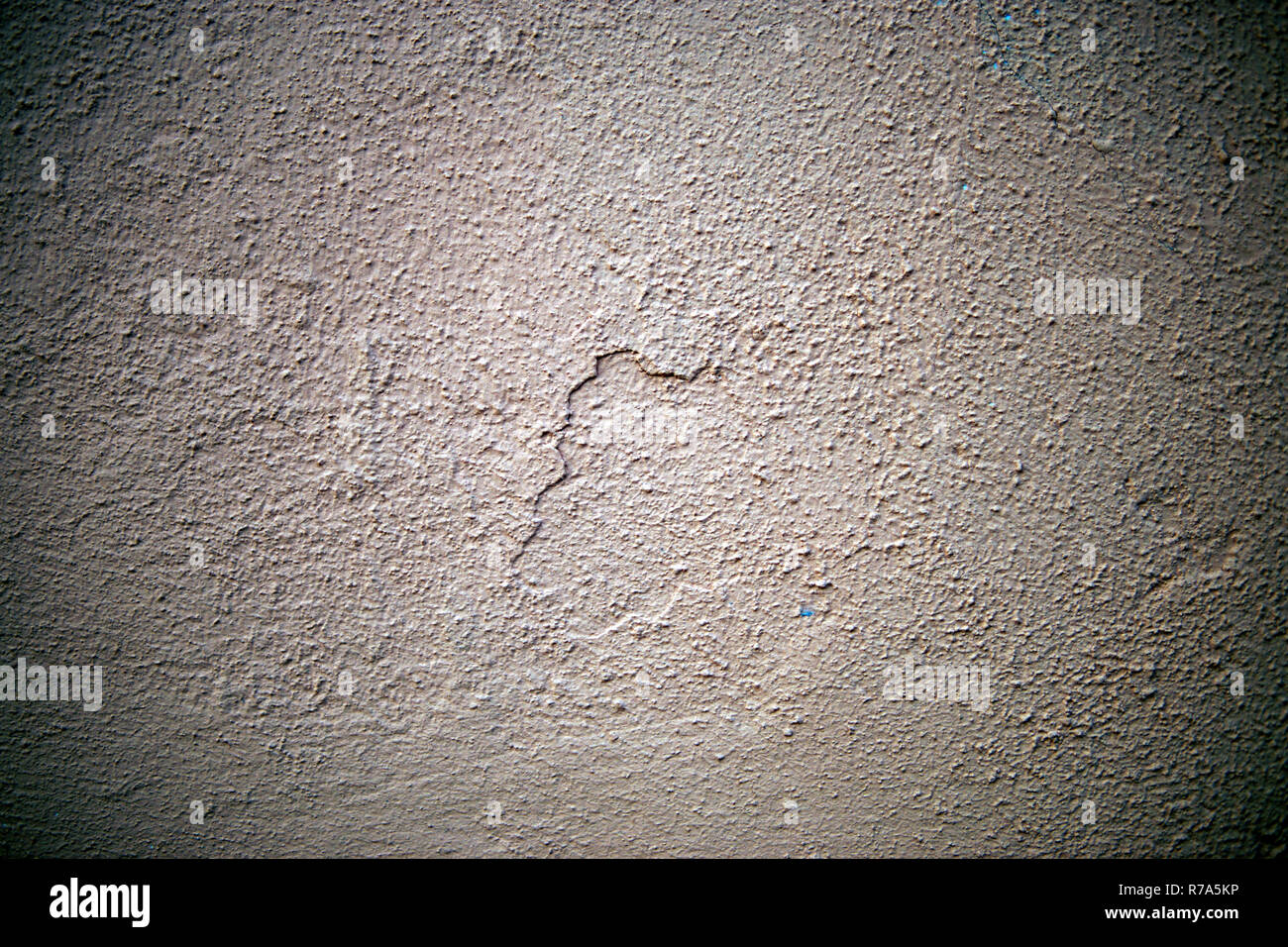 A stone wall covered in plaster Stock Photo - Alamy