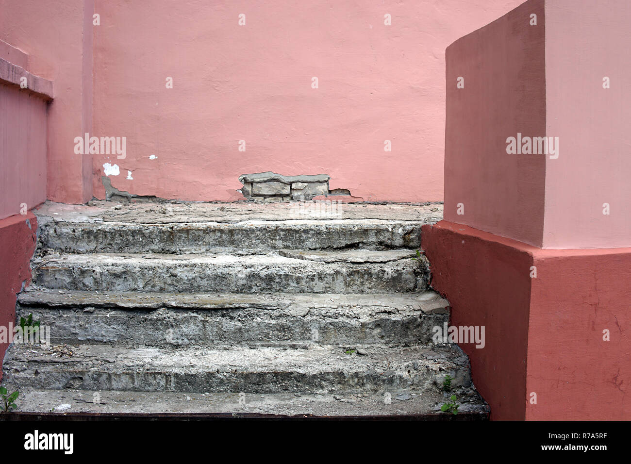 The shattered concrete steps and rose walls Stock Photo - Alamy