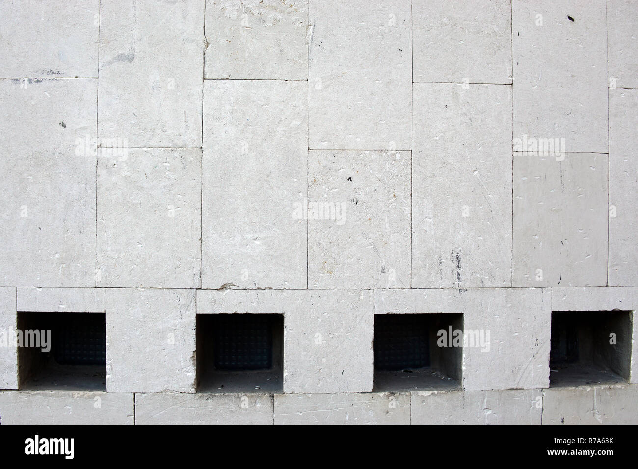 Stone wall with four windows close up Stock Photo - Alamy