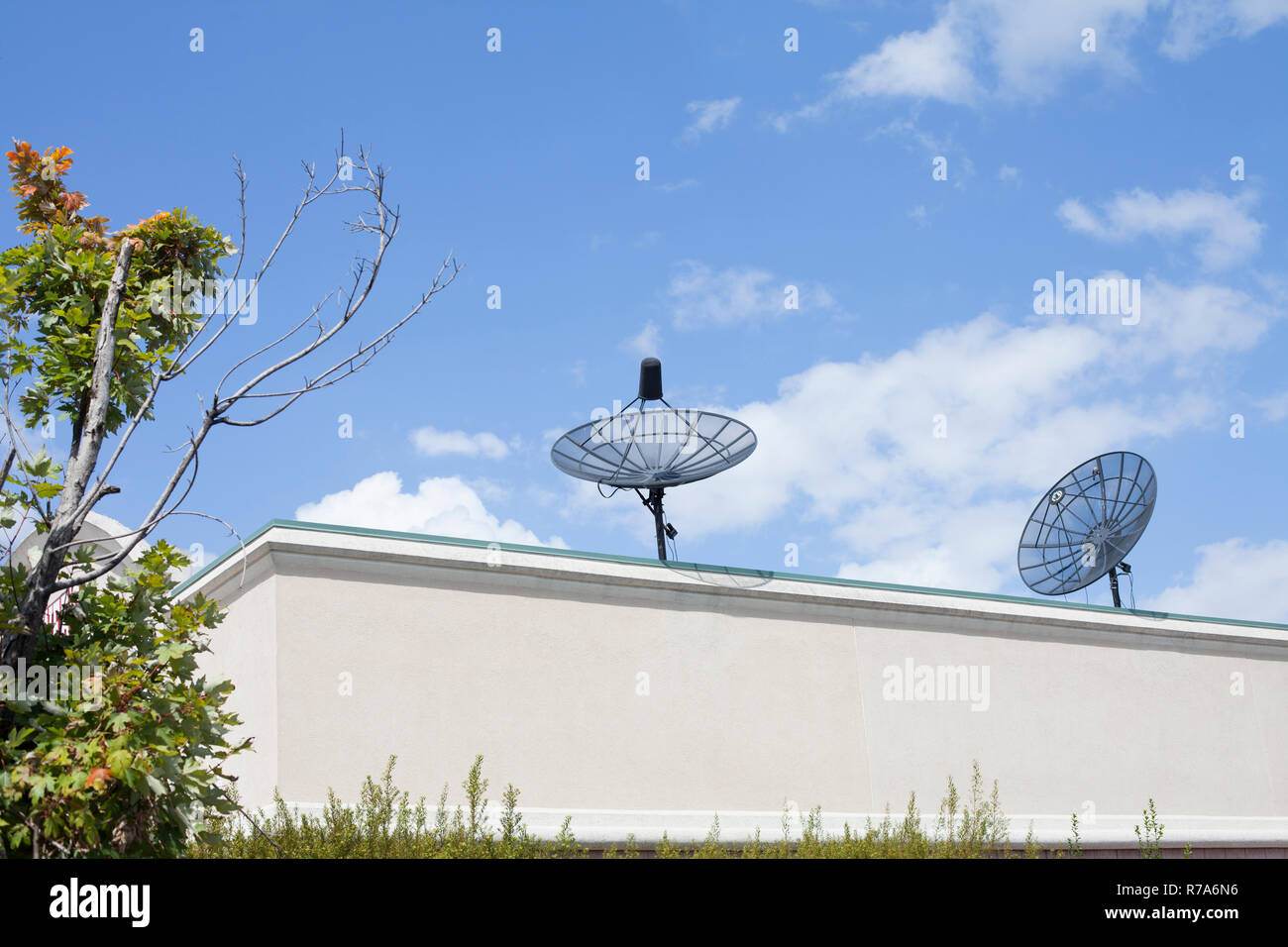 Two Satellites on Building Stock Photo - Alamy